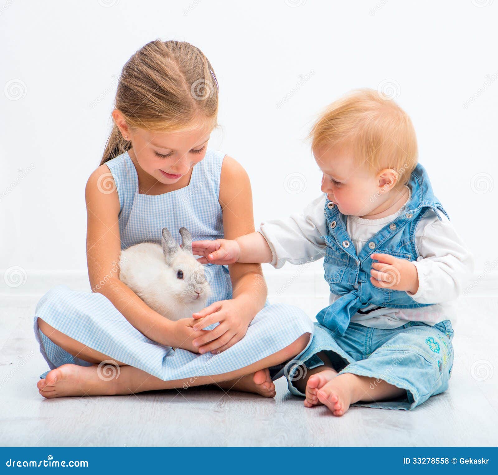 Little Sisters with a Rabbit Stock Photo - Image of spring, caucasian ...