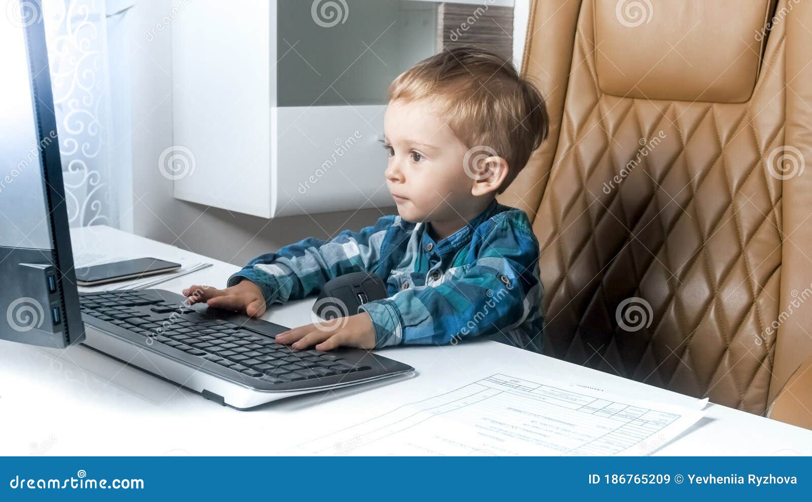 Little Smart Toddler Boy Sitting in Office and Working on Computer ...
