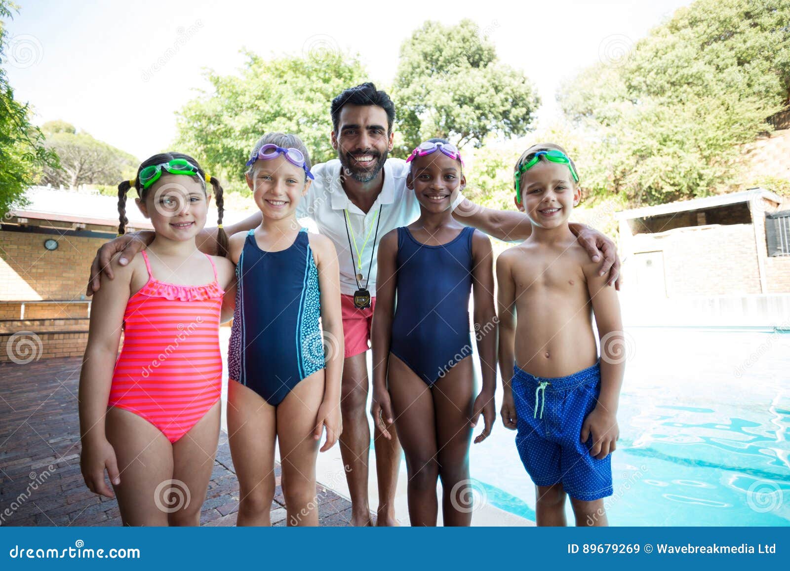 Little Swimmers with Trainer Standing at Poolside Stock Image - Image ...