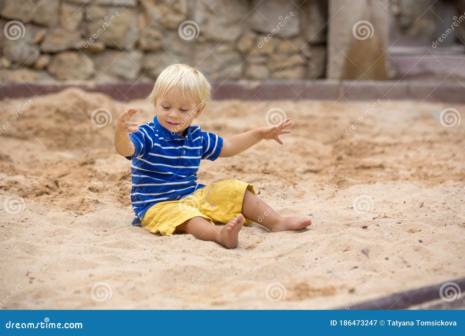 Little Toddler Boy, Playing with Sand in Sandpit at the Playground ...