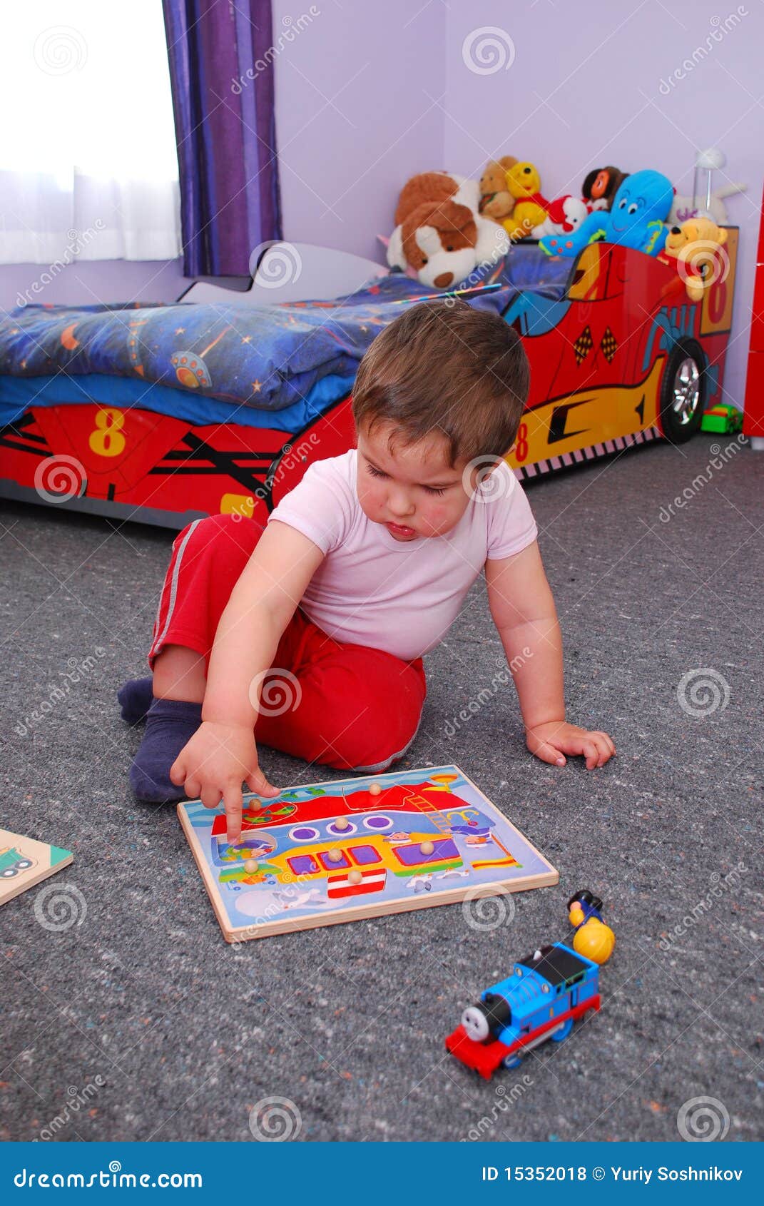 Little Toddler is Playing with Colorful Puzzle Stock Photo - Image of ...