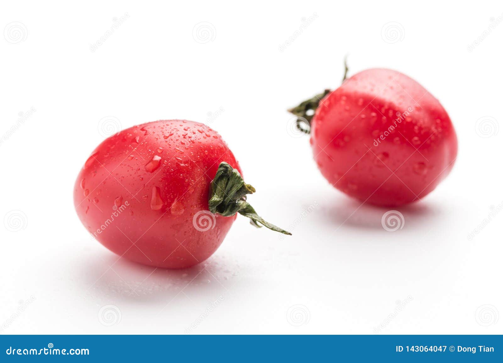 Delicious little tomatoes stock image. Image of leaves - 143064047