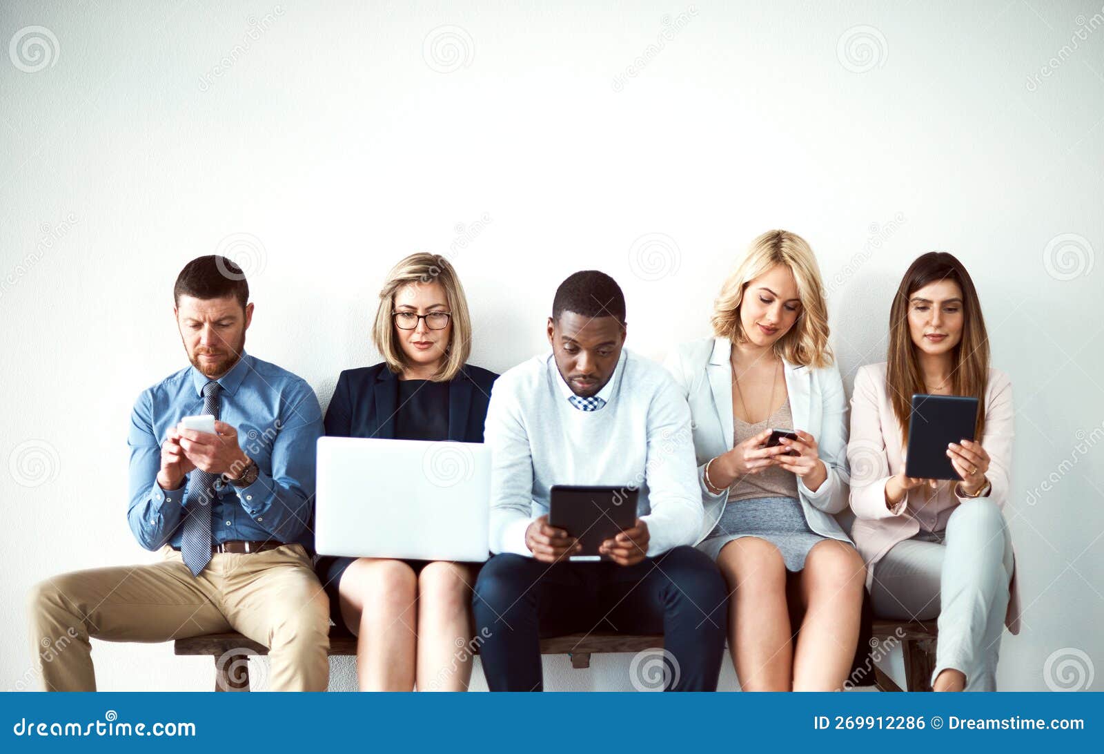They Live for Technology. a Group of Work Colleagues Seated Next To ...