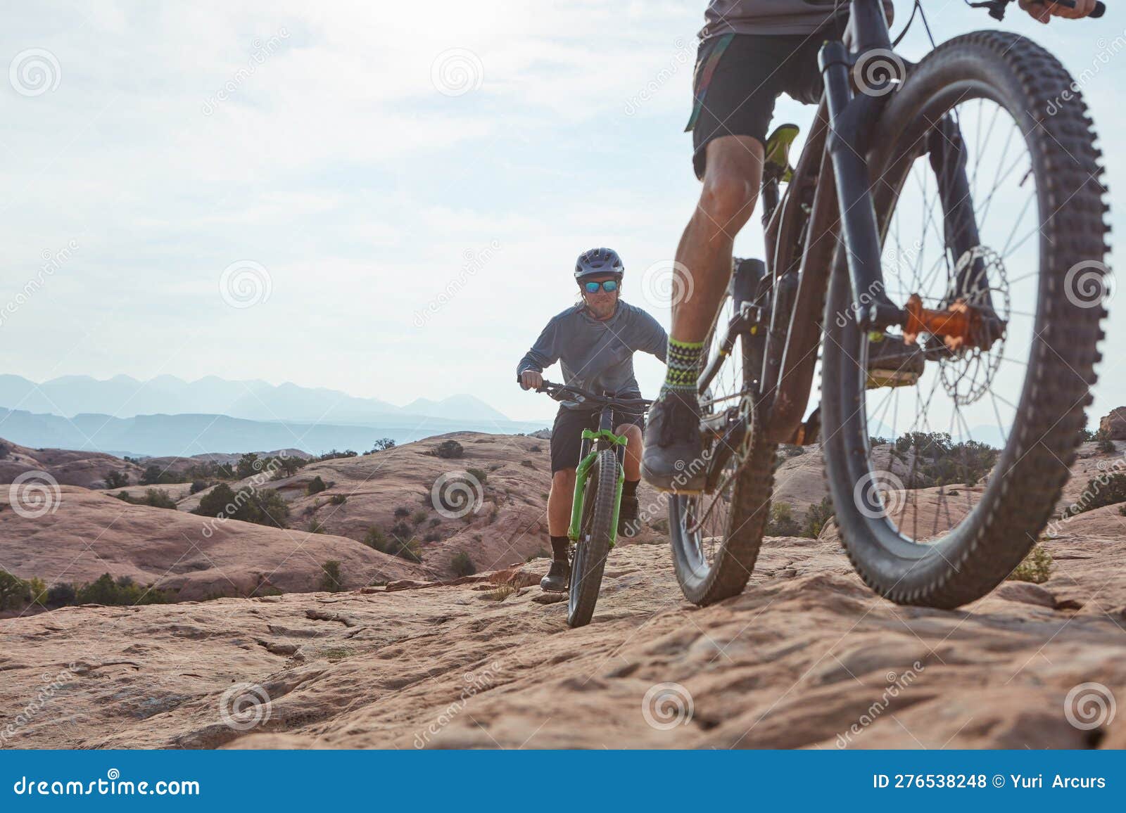 Live Your Passion. Two Athletic Men Mountain Biking through the ...