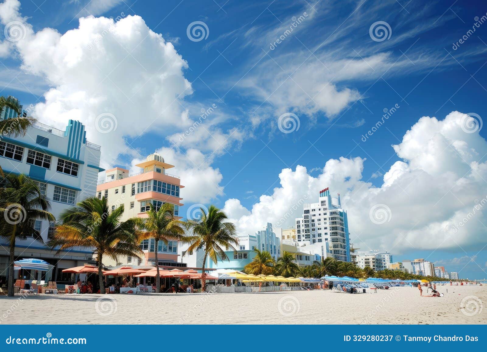 A Lively Beach Scene in Miami with Art Deco Buildings in the Backdrop ...