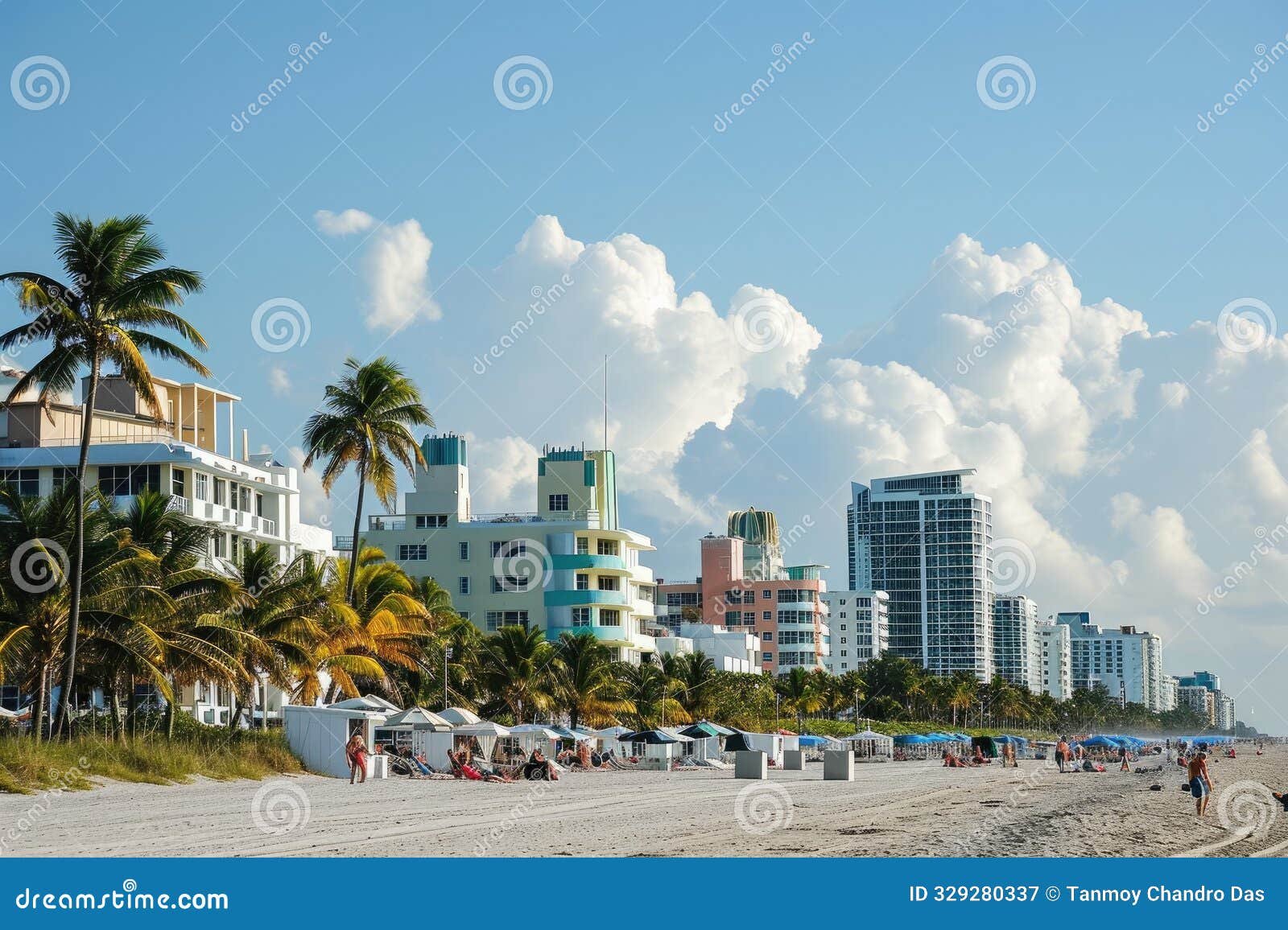 A Lively Beach Scene in Miami with Art Deco Buildings in the Backdrop ...