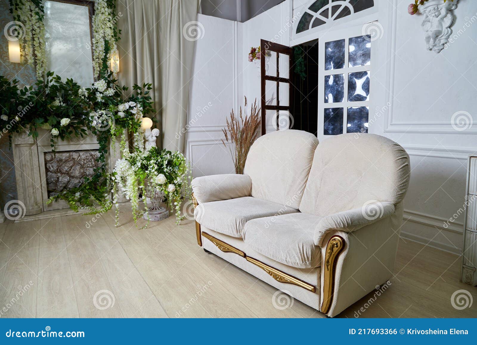 Living Room with a Beautiful Interior, Sofa and Flowers Stock Photo ...