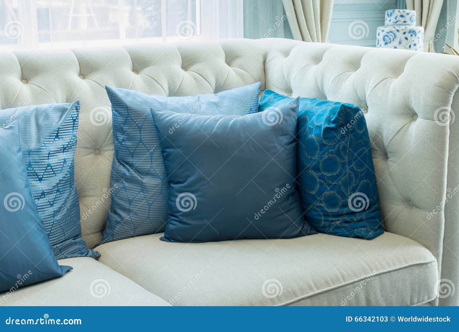 Living Room with Blue Pattern Pillows on Sofa Stock Image - Image of ...