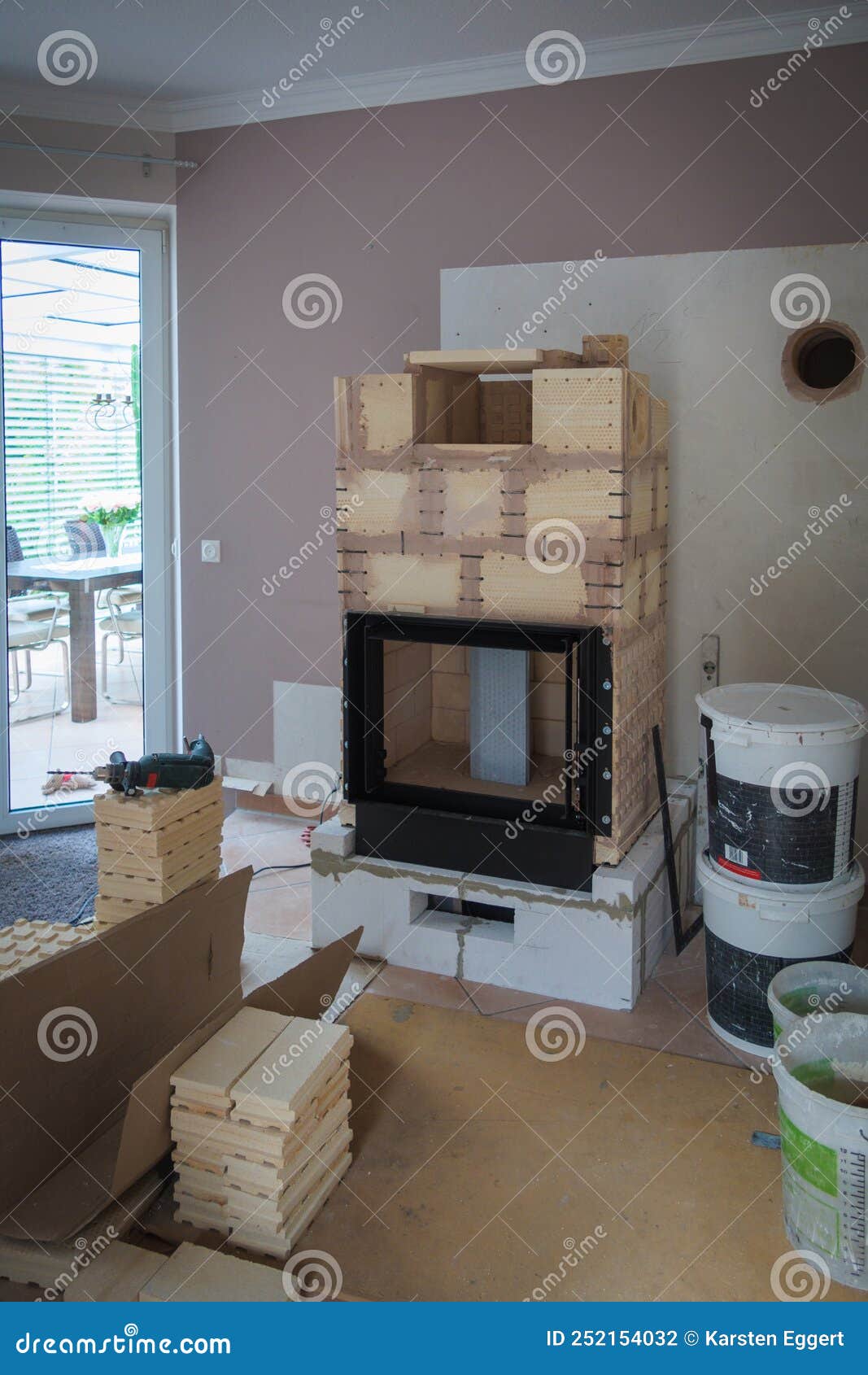 In a Living Room is Built a Tiled Stove Stock Photo - Image of indoors ...