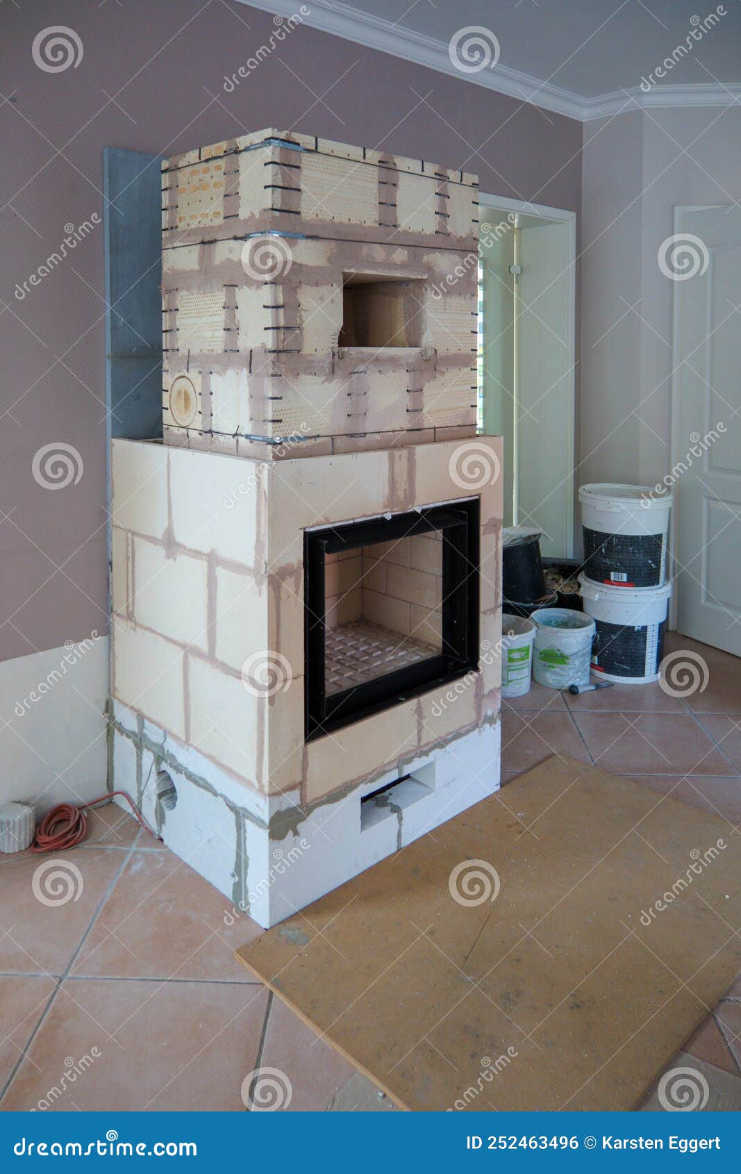 In a Living Room is Built a Tiled Stove Stock Photo - Image of cabinet ...