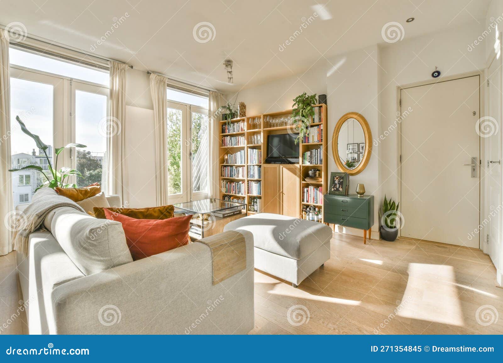 A Living Room with a Couch and a Book Shelf Editorial Image - Image of ...
