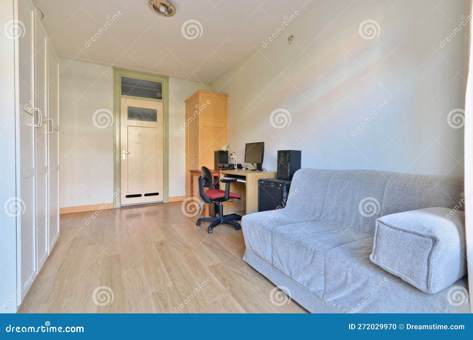 A Living Room with a Couch and a Desk Stock Photo - Image of sofa ...