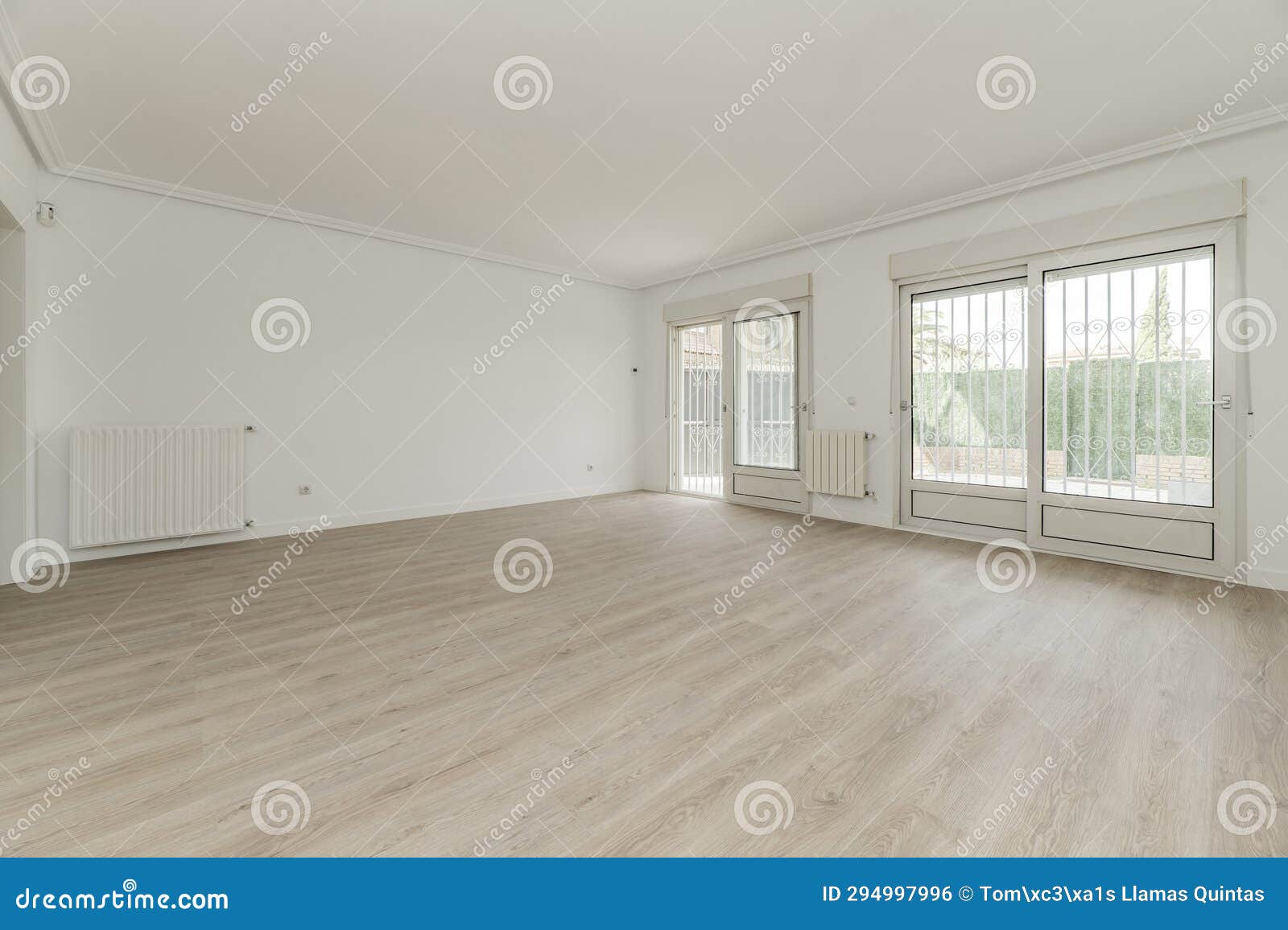 Living Room of an Empty House with White Painted Walls, Large Exit ...