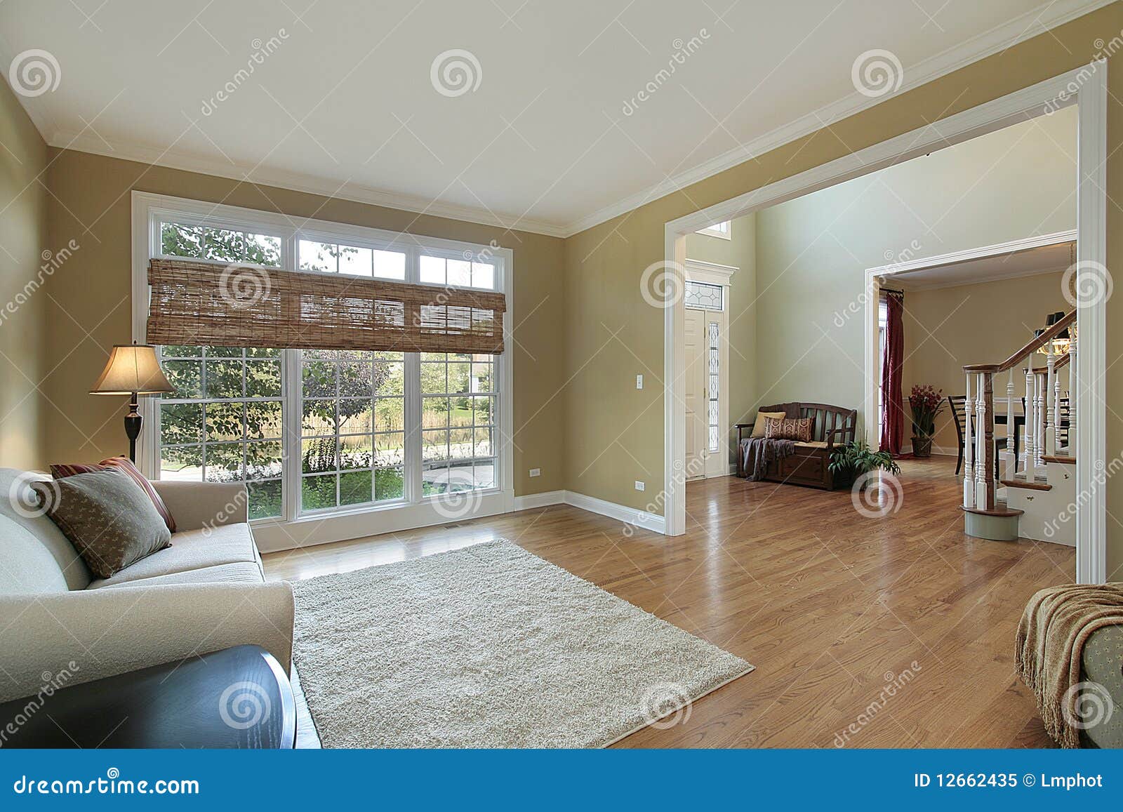 Living Room with Foyer View Stock Image - Image of couch, lighting ...