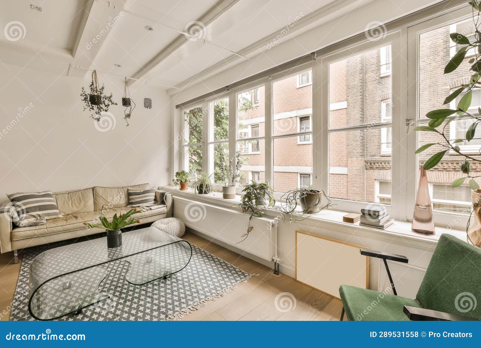 A Living Room with a Large Window and a Table Stock Photo - Image of ...