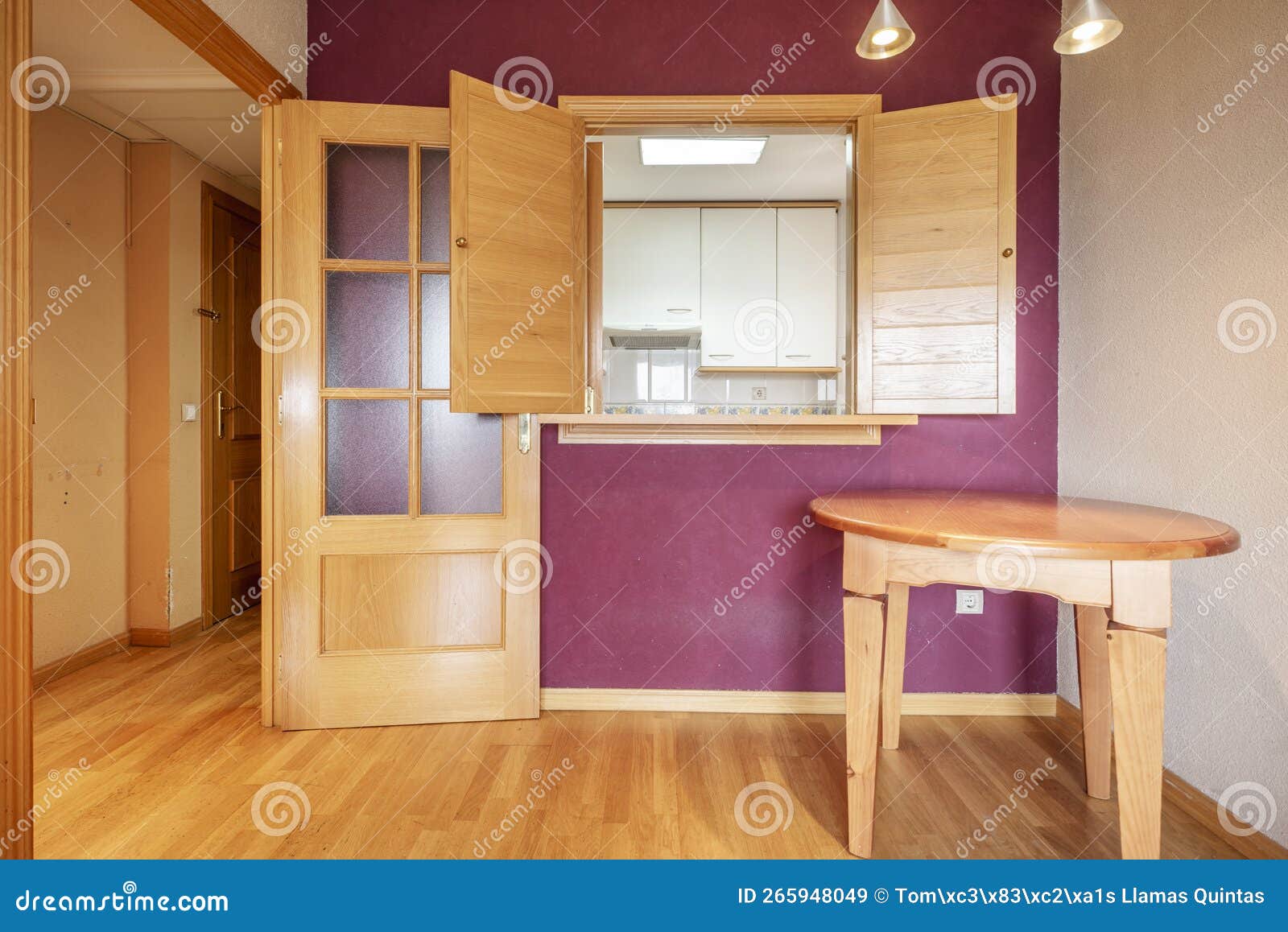 Living Room with a Round Pine Wood Dining Table in the Corner and a ...