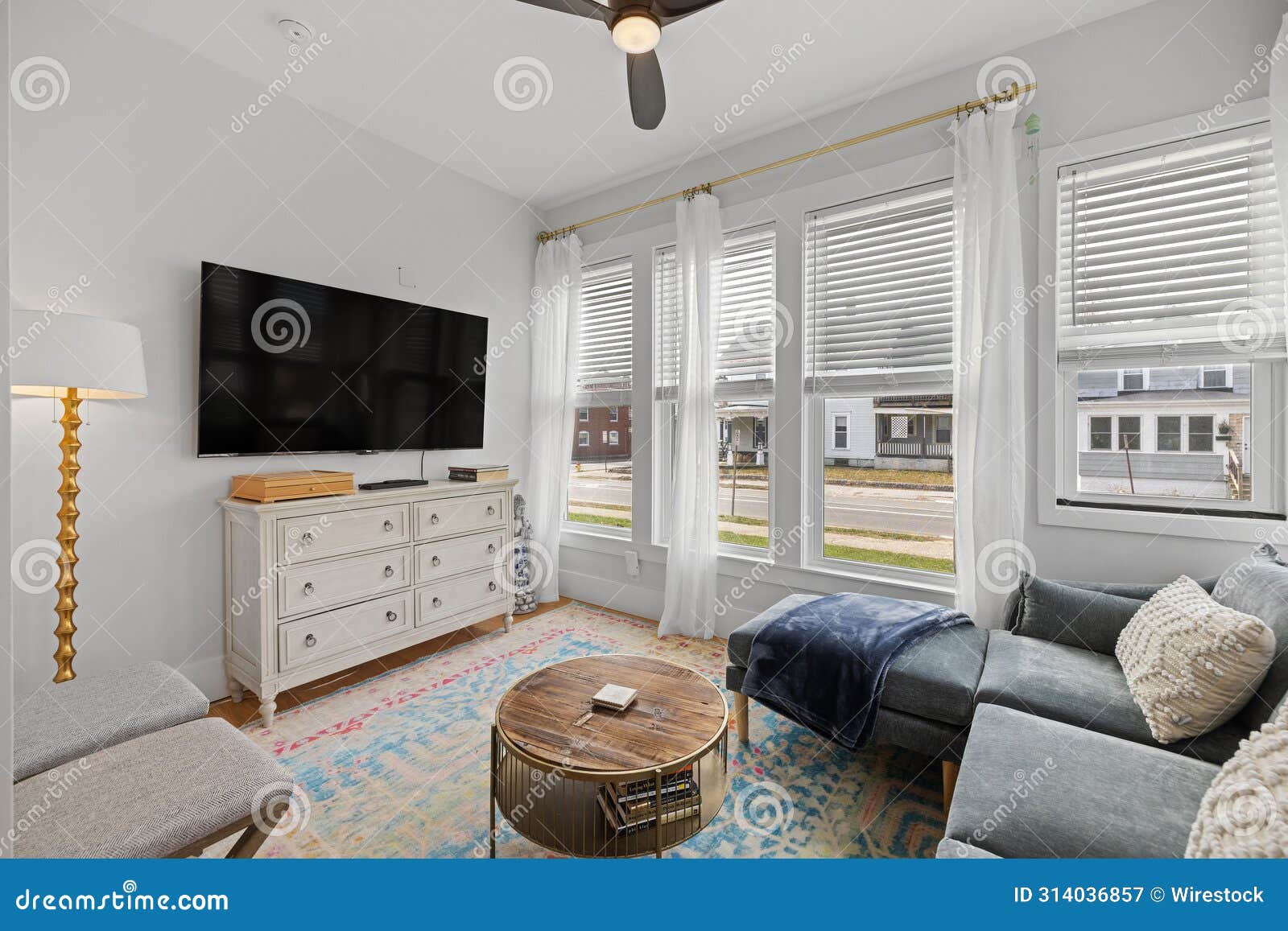 Living Room with Windows and a Big Screen TV. Stock Image - Image of ...