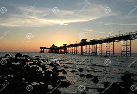 Llandudno Pier 01 stock photo. Image of coast, pier, sunrise - 910894