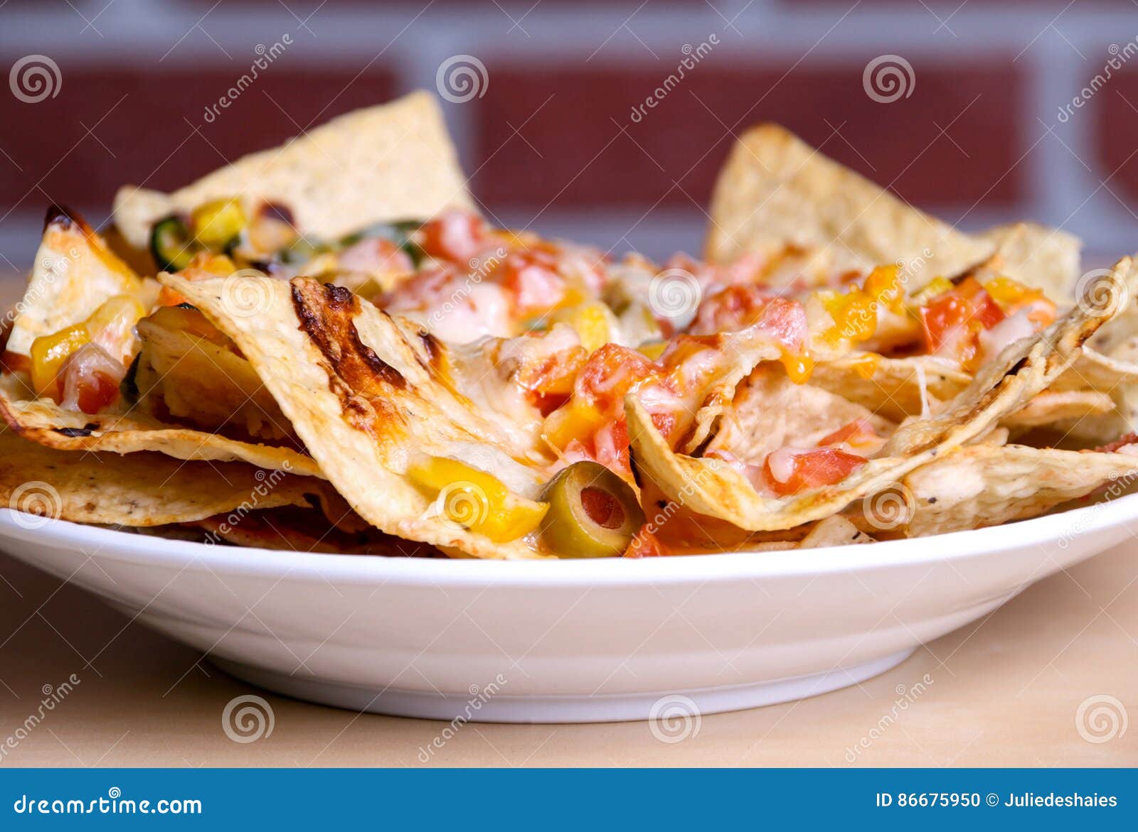 Loaded cheese nacho stock photo. Image of bistro, chip - 86675950