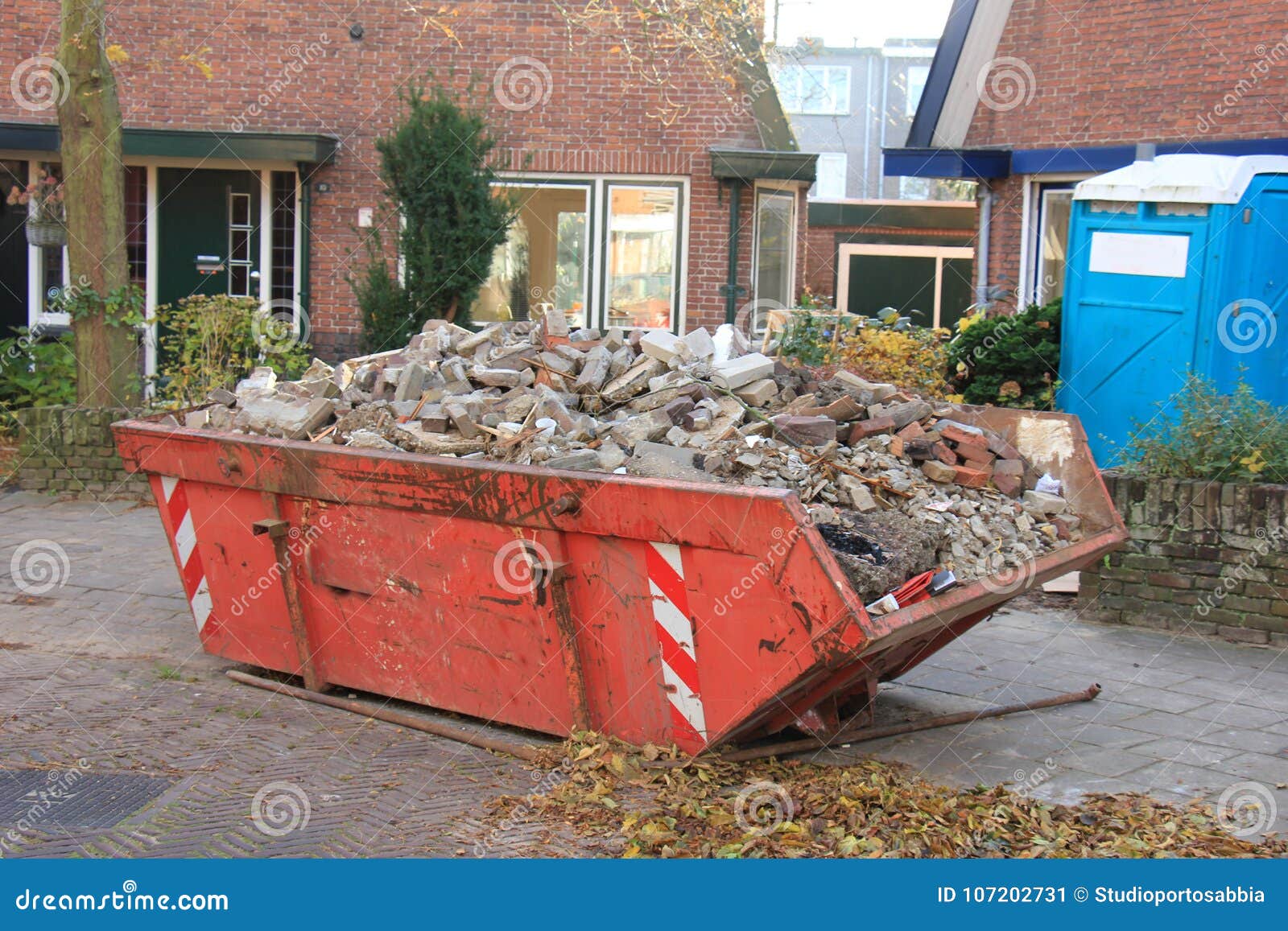 Loaded garbage dumpster stock image. Image of household - 107202731