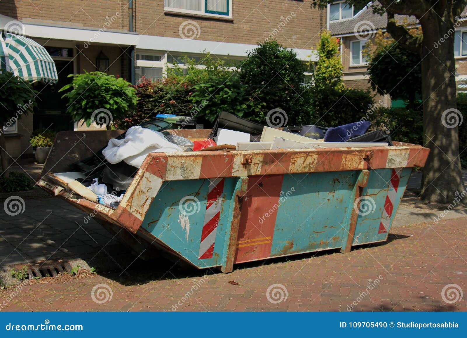 Loaded garbage dumpster stock photo. Image of building - 109705490