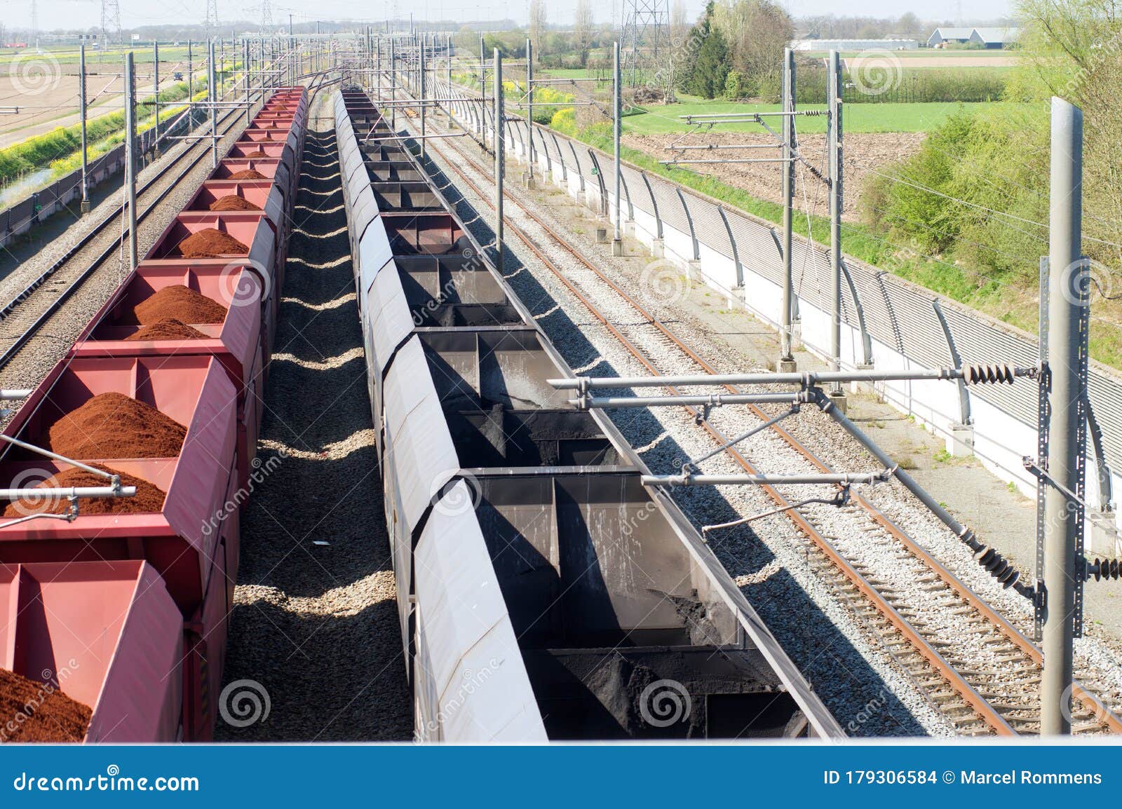 A Loaded Freight Train and a Empty Freight Train Stock Photo - Image of ...
