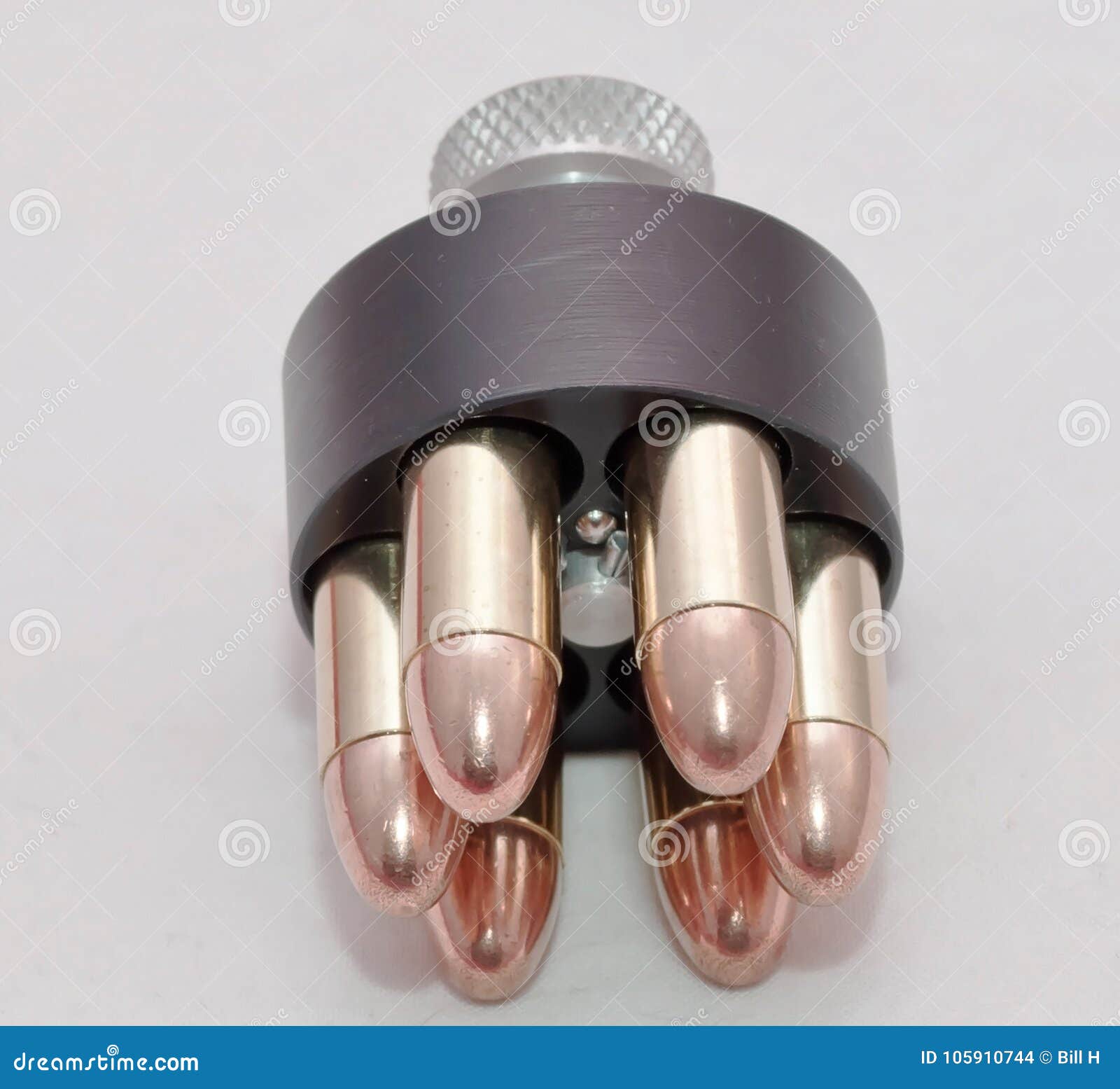 A Loaded Revolver Speed Loader Stock Photo - Image of protect, cylinder ...