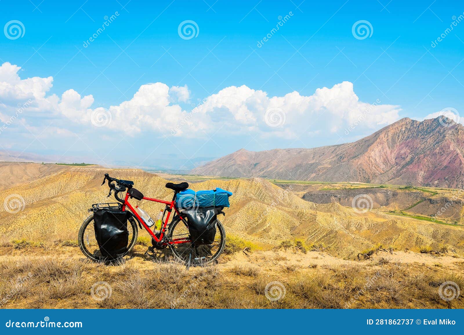 Loaded Touring Bicycle Stands with Moody Dramatic Panoramic Mountains ...