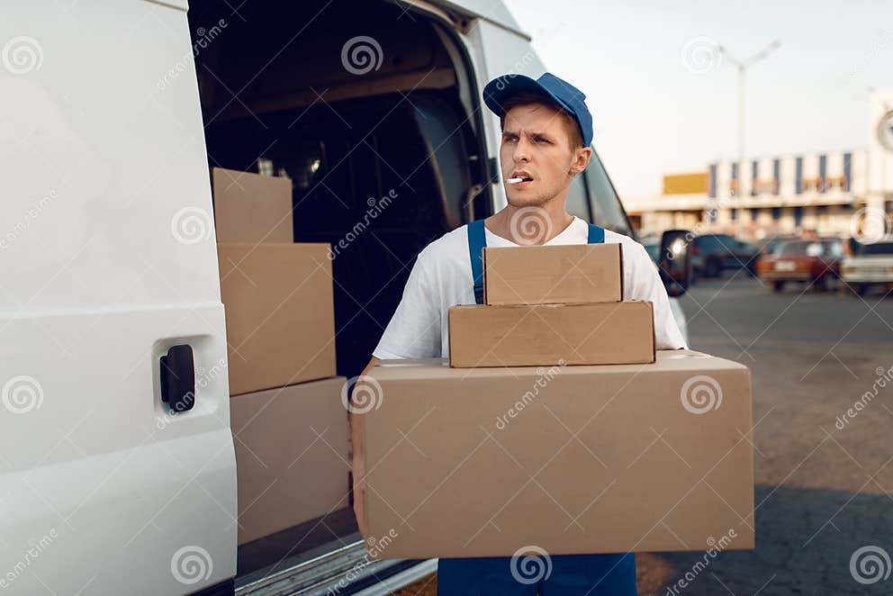Loader Holding Stack of Parcels, Delivery Service Stock Photo - Image ...
