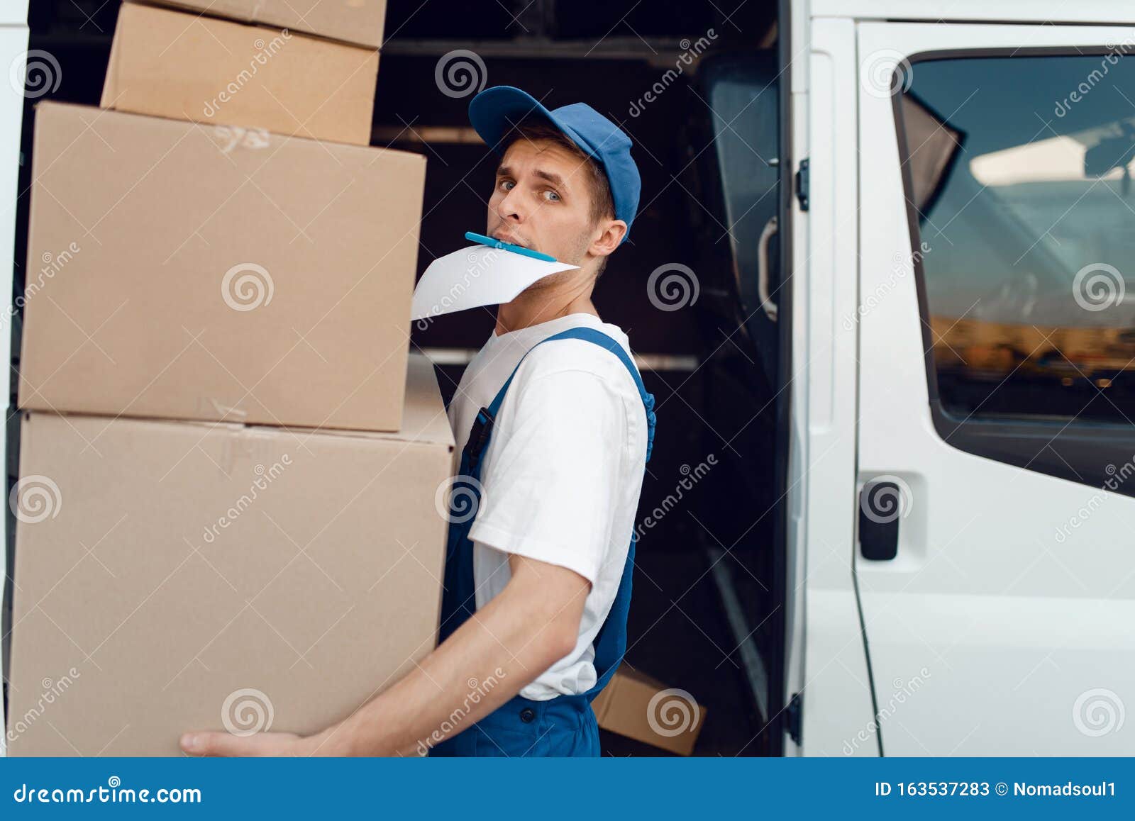 Loader Holding Stack of Parcels, Delivery Service Stock Image - Image ...