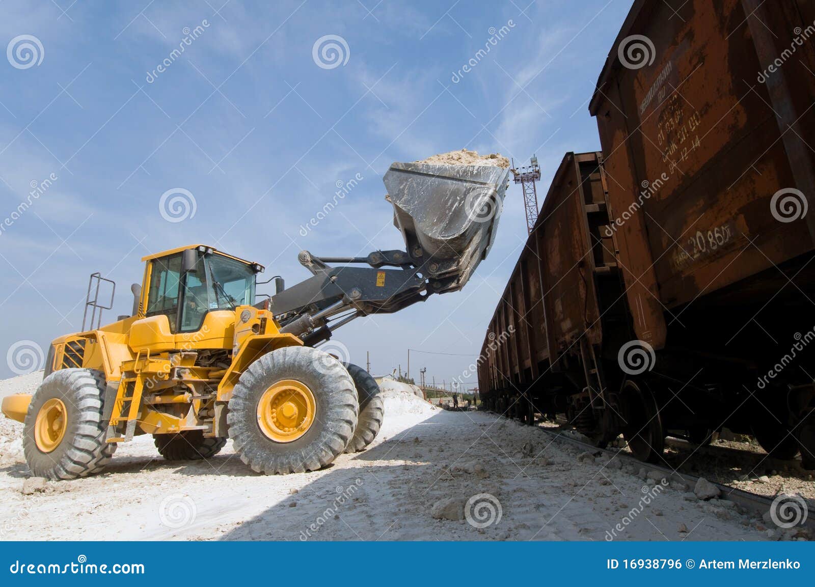 Loader Loads the Wagon Train Stock Photo - Image of color, machine ...