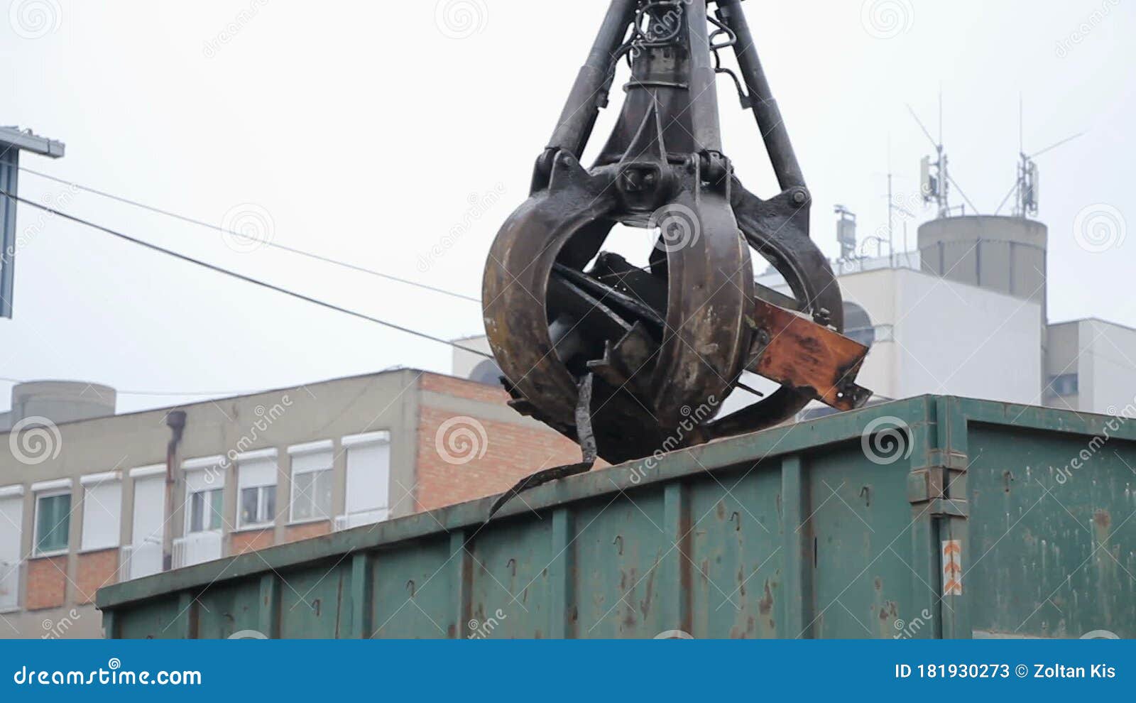 Loader Manipulator with Hydraulic Grappling Claw is Loading Scrap Metal ...