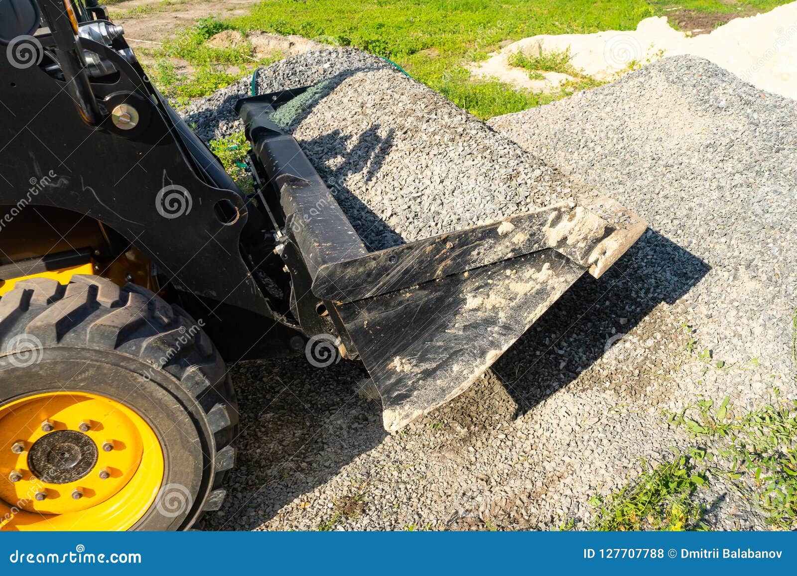 The Loader Picked Up Rubble in the Bucket for Construction Work. Stock ...