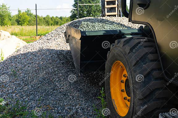 The Loader Picked Up Rubble in the Bucket for Construction Work. Stock ...