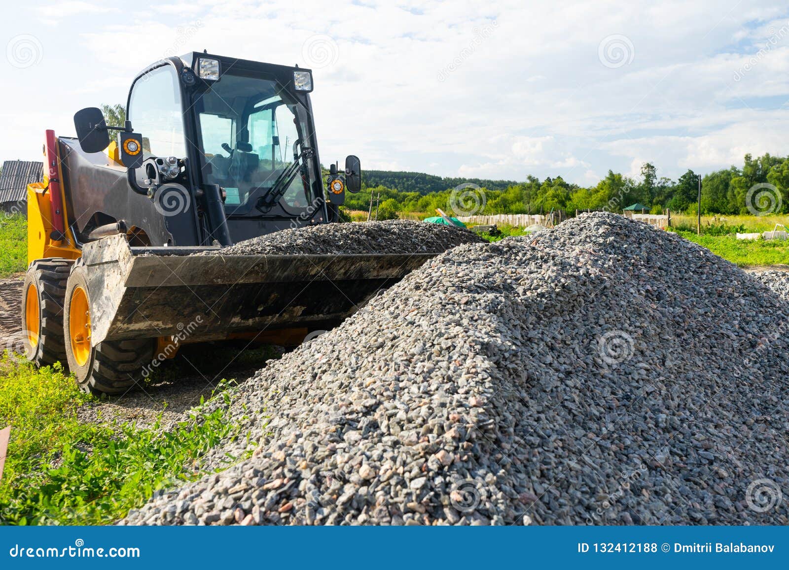 The Loader Picked Up Rubble in the Bucket for Construction Work Stock ...
