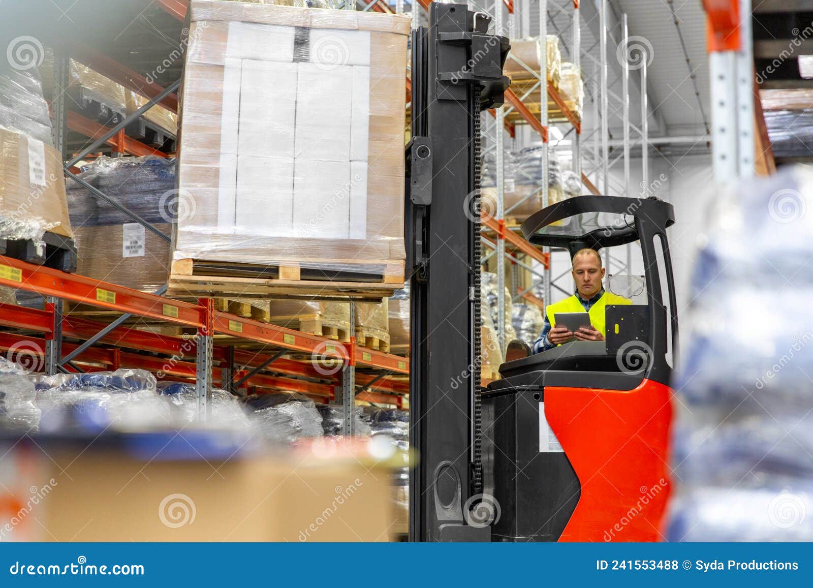 Loader with Tablet Pc on Forklift at Warehouse Stock Photo - Image of ...