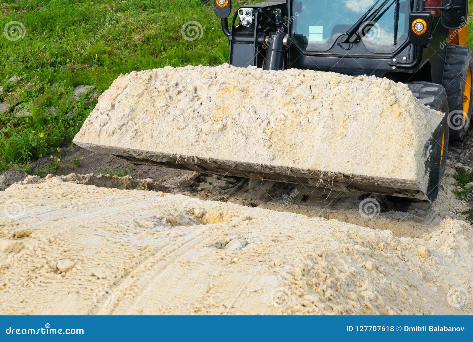 The Loader Took the Sand into the Bucket for Construction Work. Stock ...