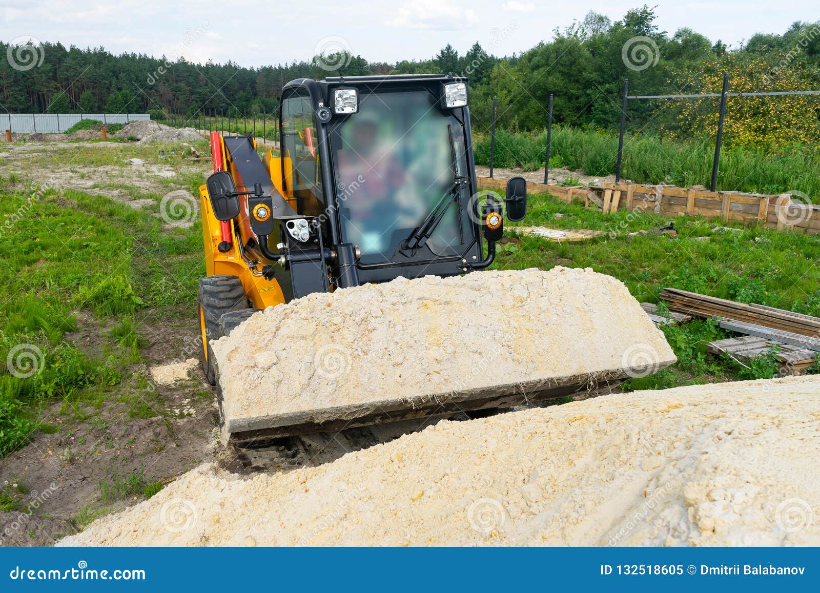 The Loader Took the Sand into the Bucket for Construction Work Stock ...