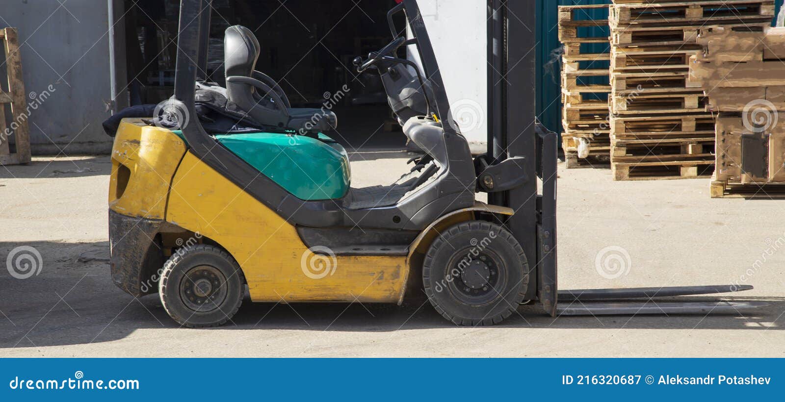 The Loader is in the Warehouse. Loading of Goods in the Warehouse Stock ...