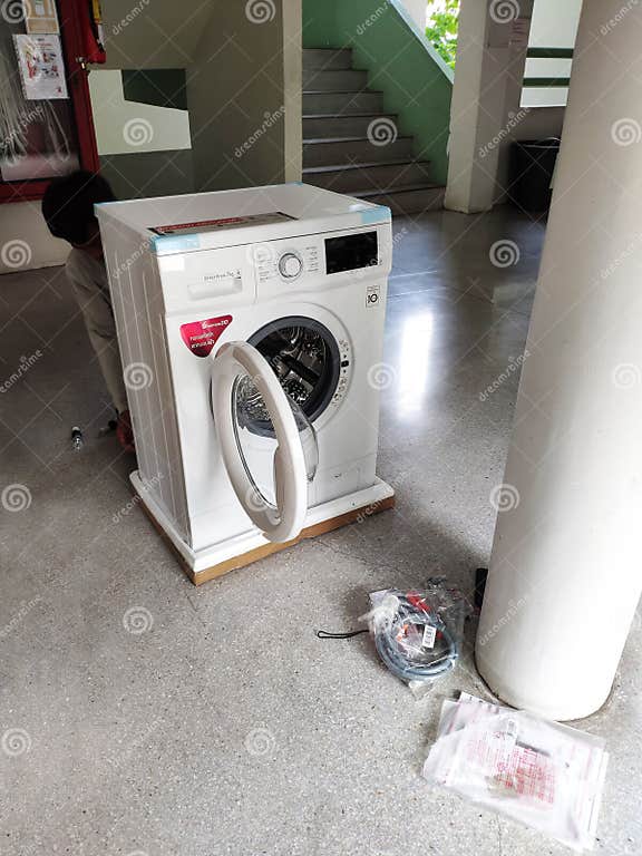 Loaders Carrying Washing Machine by Using Cargo Belts Stock Photo ...