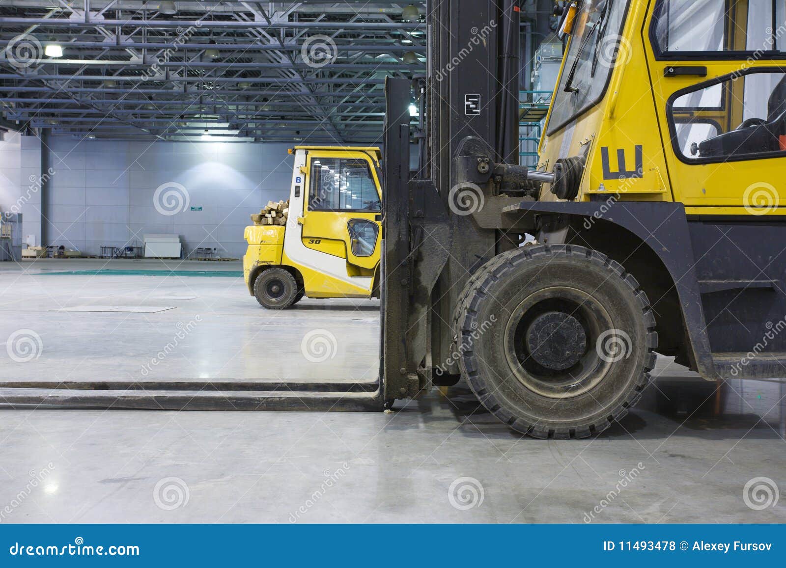 Loaders in Modern Storehouse Stock Photo - Image of frame, industrial ...