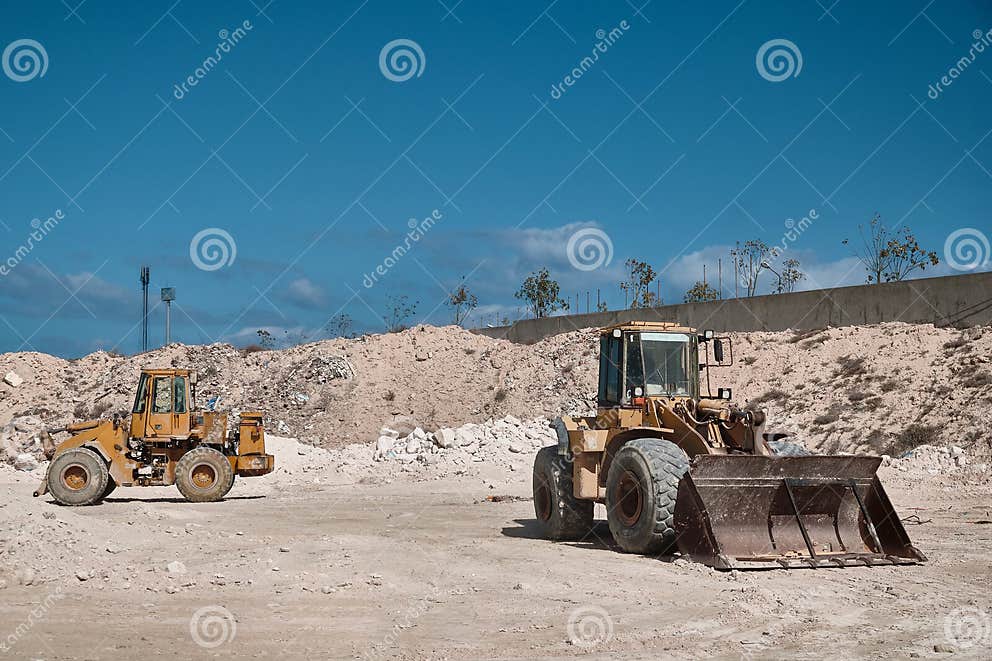 Loaders in a quarry stock photo. Image of machinery - 321420654