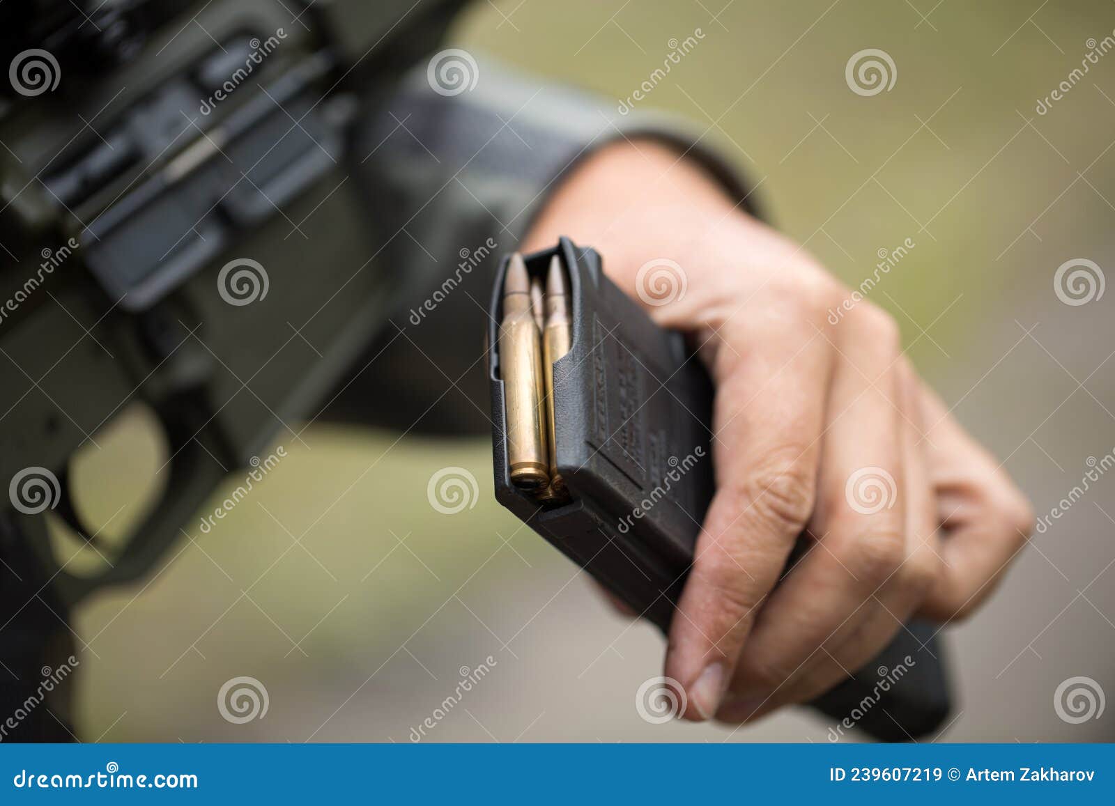 Loading Ammunition into a Clip. Reloading Weapons. Stock Image - Image ...