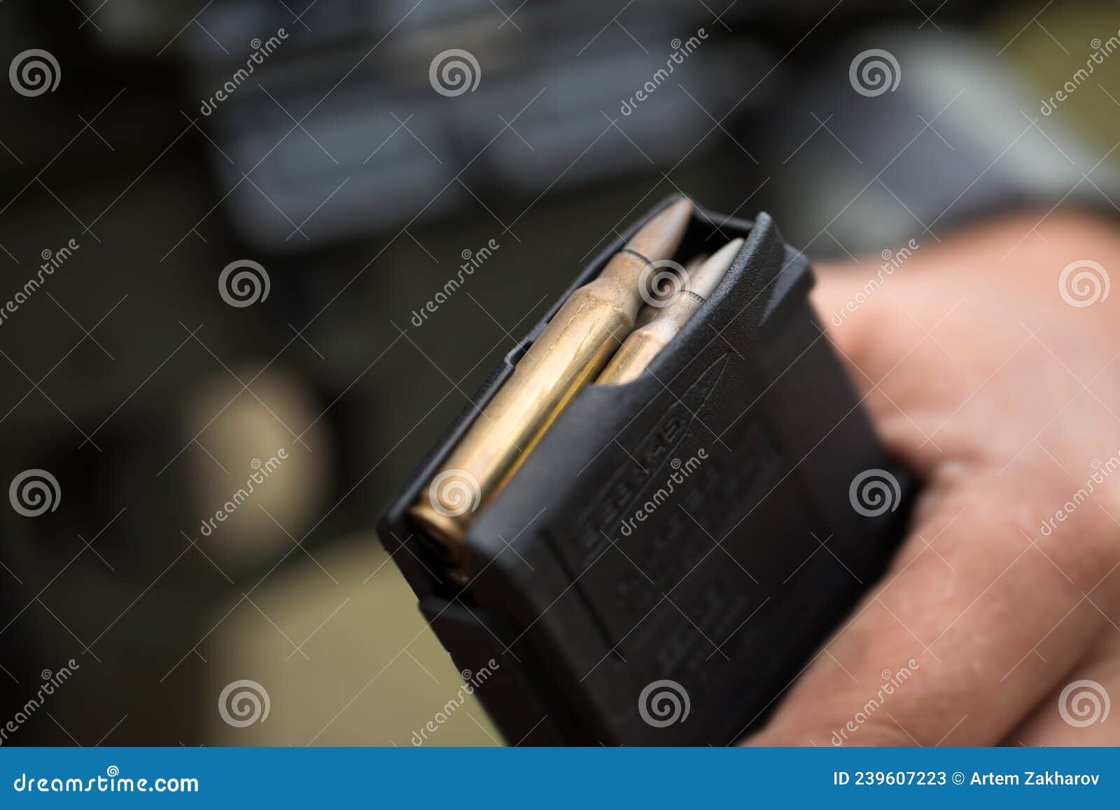 Loading Ammunition into a Clip. Reloading Weapons. Stock Image - Image ...