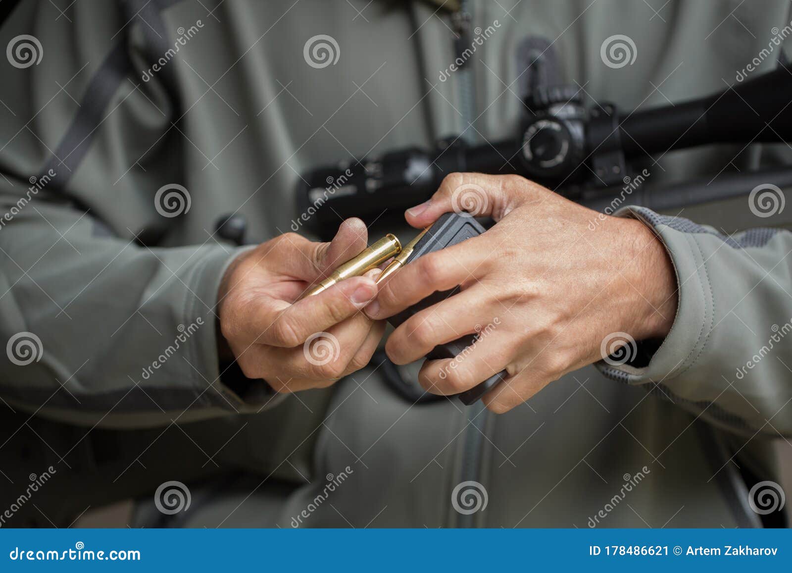 Loading Ammunition into a Clip. Reloading Weapons. Stock Image - Image ...