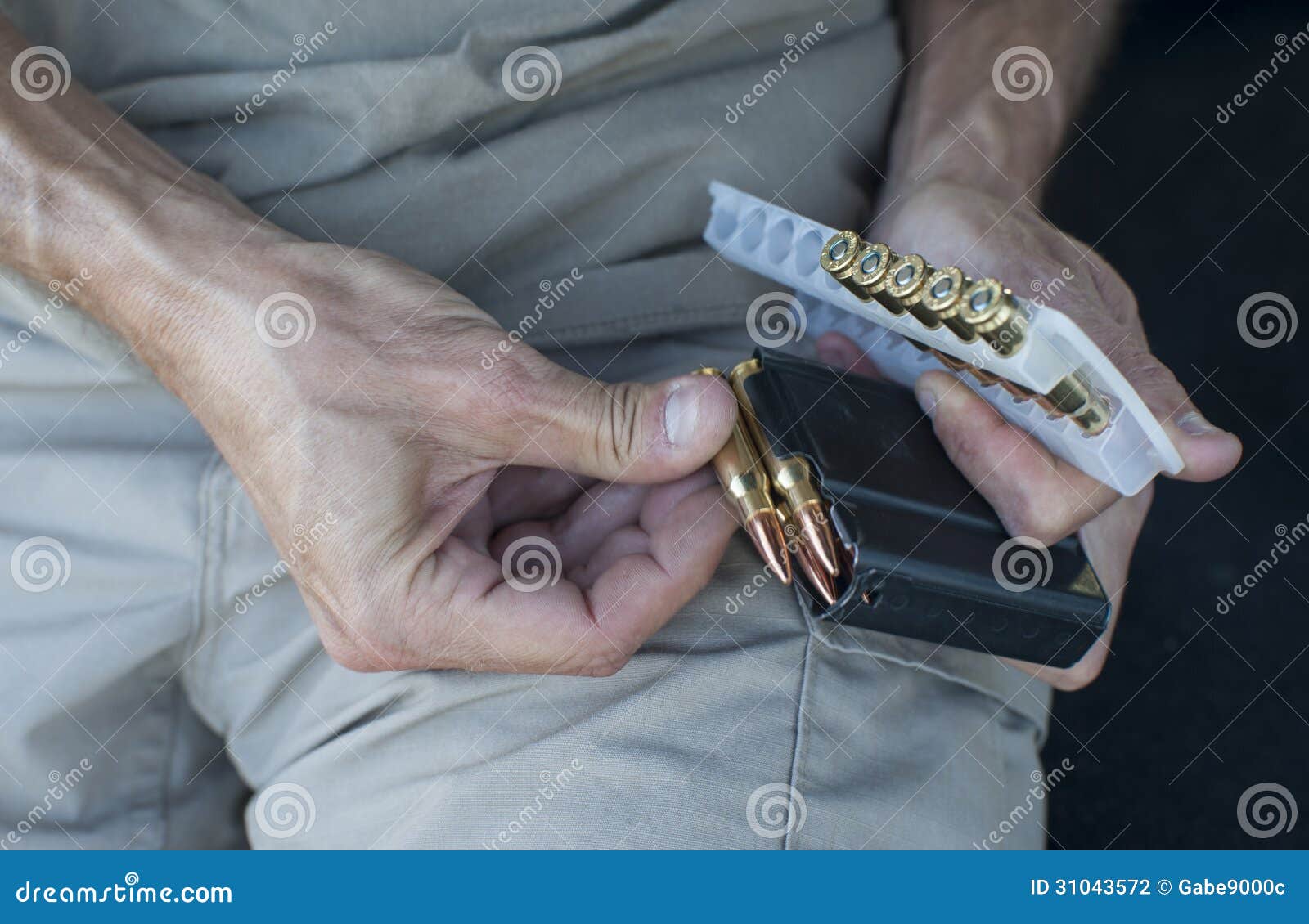 Loading Ammunition into Rifle Clip Stock Photo - Image of loading ...