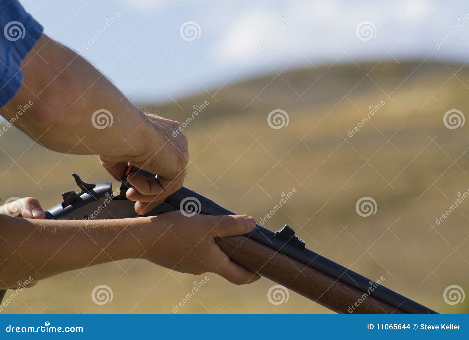 Loading black powder rifle stock photo. Image of position - 11065644