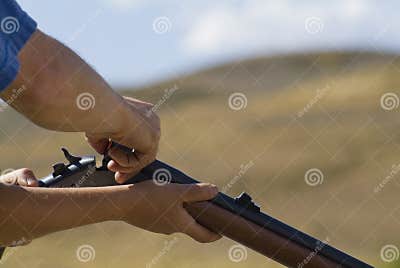 Loading black powder rifle stock photo. Image of position - 11065644