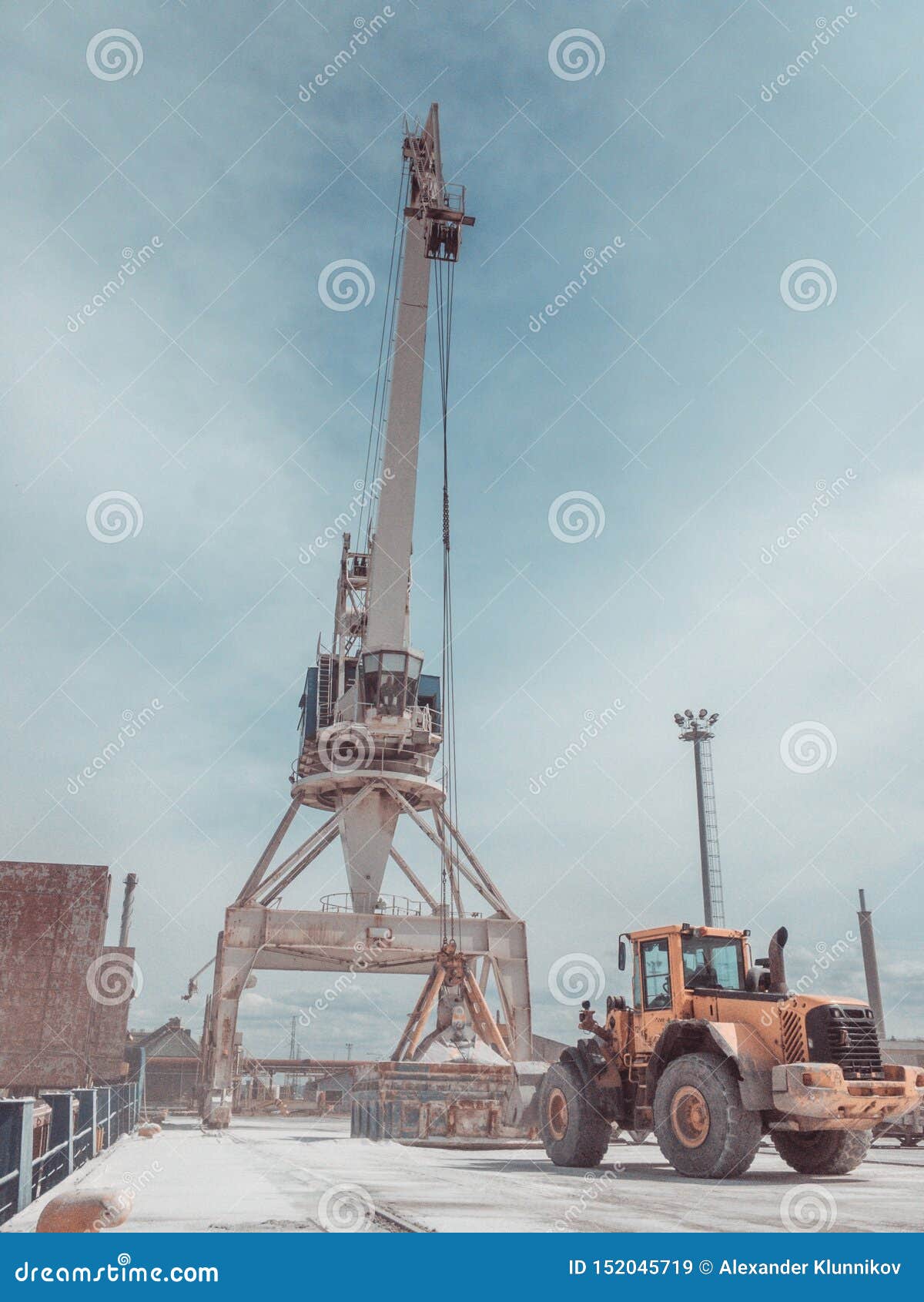 Loading Bulk Cargo on the Cargo Ship. Old Crane. Bulk Cargo Termonal ...