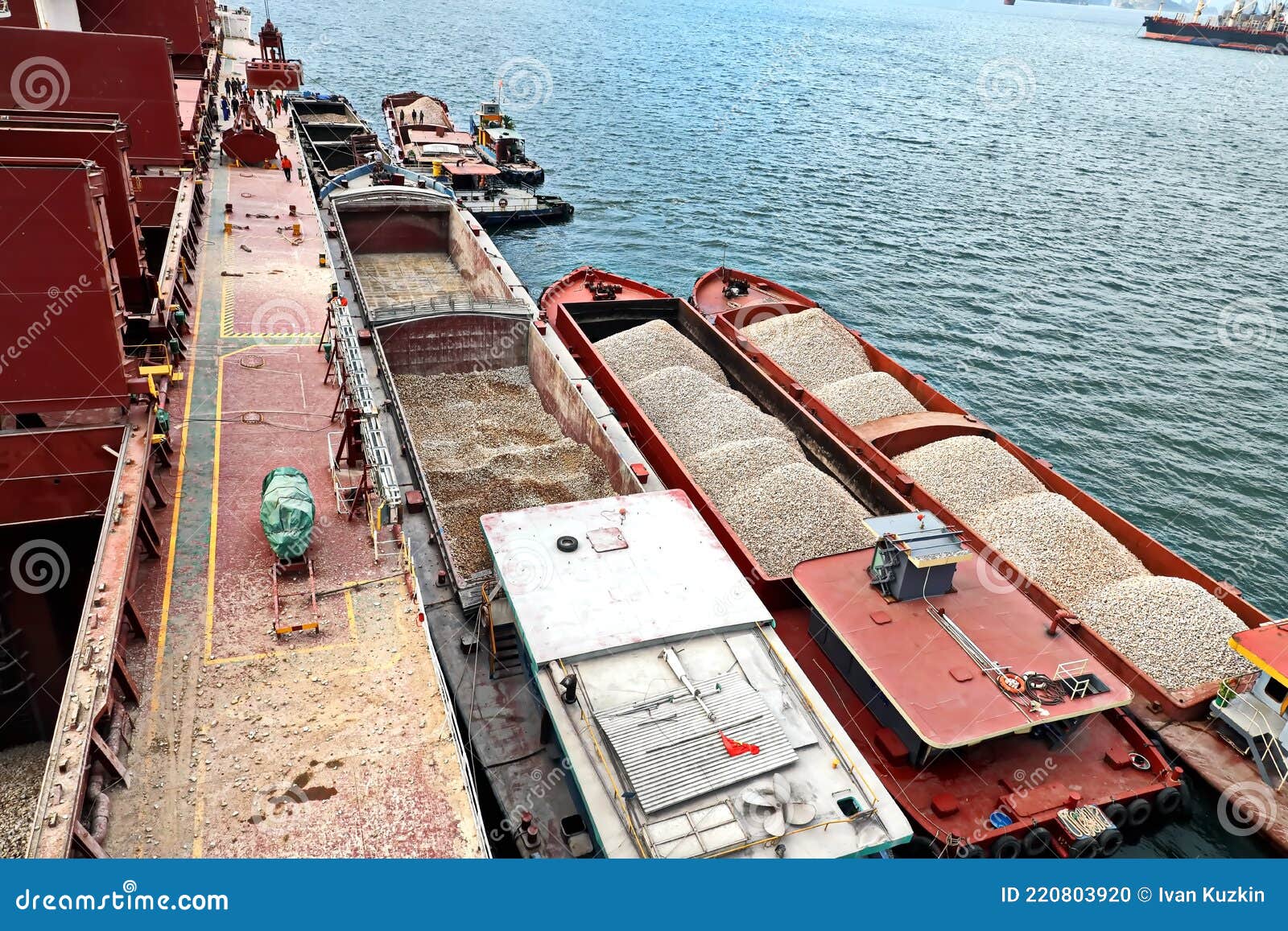 Loading Bulk Cargo of Limestone from Barges into a Bulk Carrier by ...